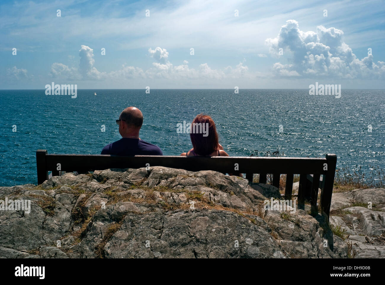 Polperro coastal path bench with sea view Stock Photo - Alamy