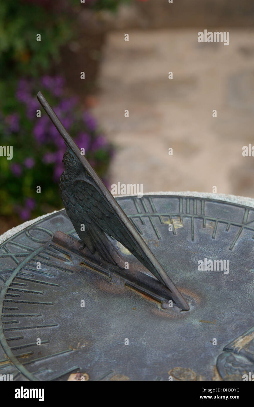 A gnomon is the part of a sundial that casts a shadow. A metal sundial ...