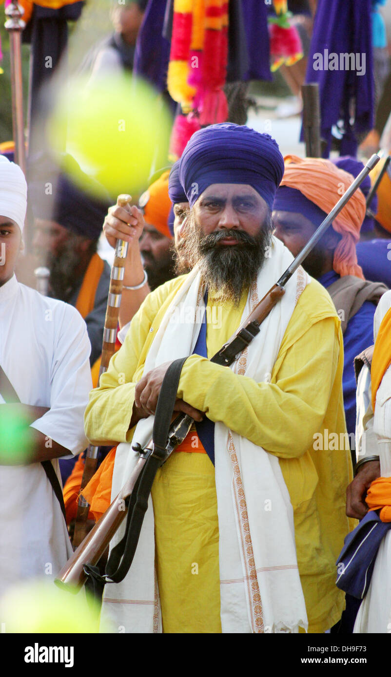 Traditional Sikh warrior or Nihang fully loaded with modern arms and ...
