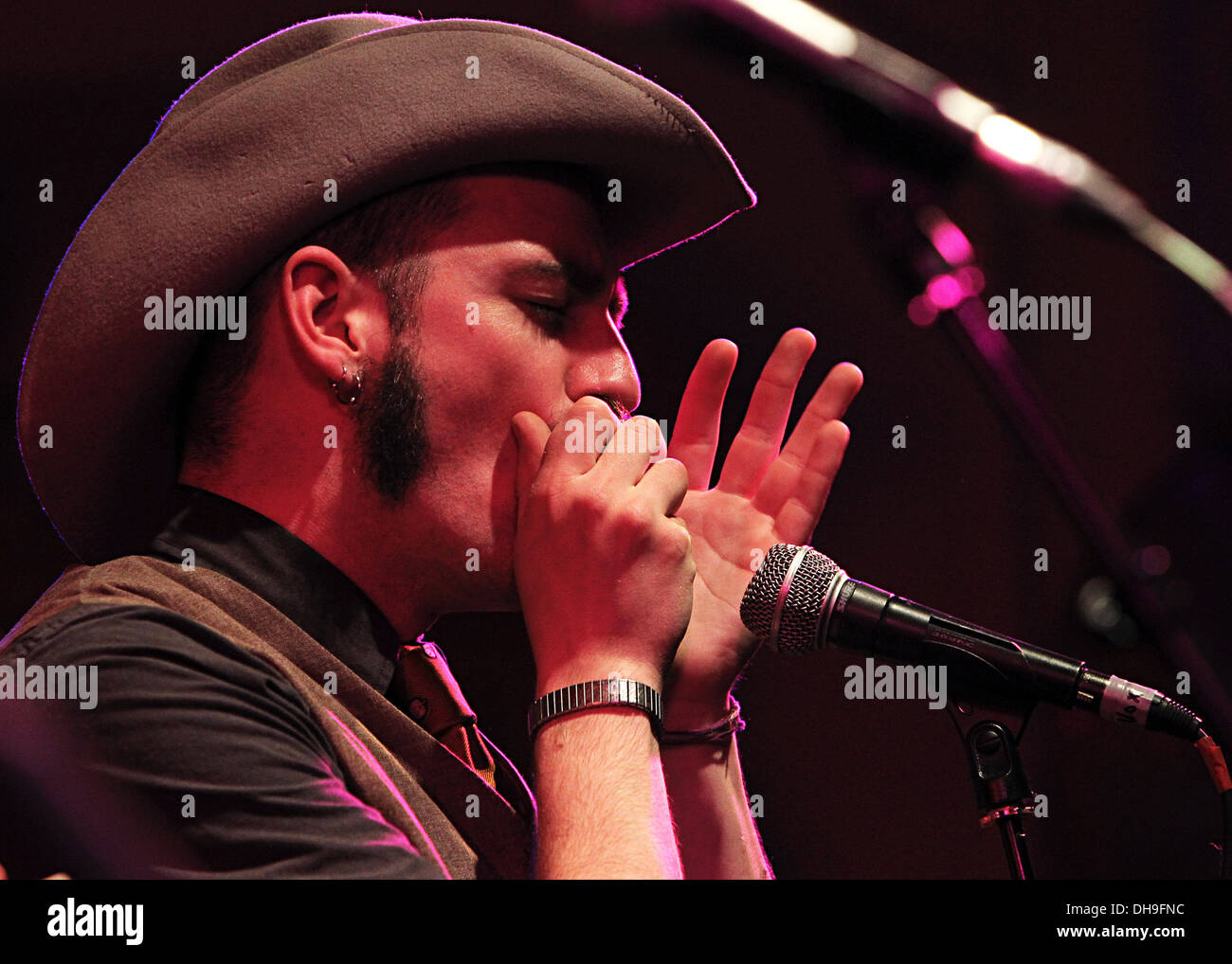 Ryan Koenig of Pokey LaFarge and South City Three performing on stage ...