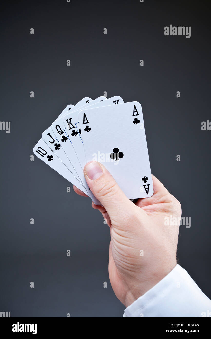Playing cards being held in mans hand Stock Photo - Alamy