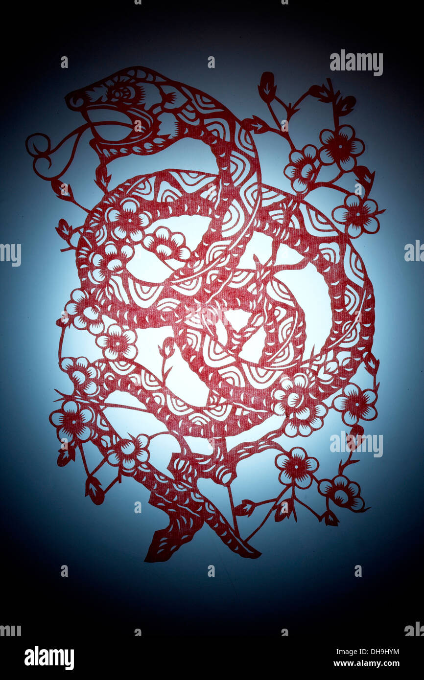 Red paper cut snake Stock Photo - Alamy