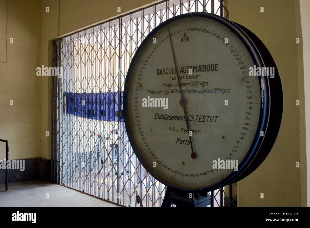 An old industrial scale stands inside the train waiting area of the ...