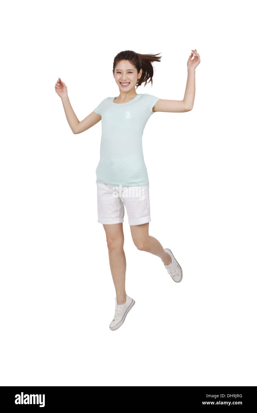 Young woman jumping Stock Photo - Alamy