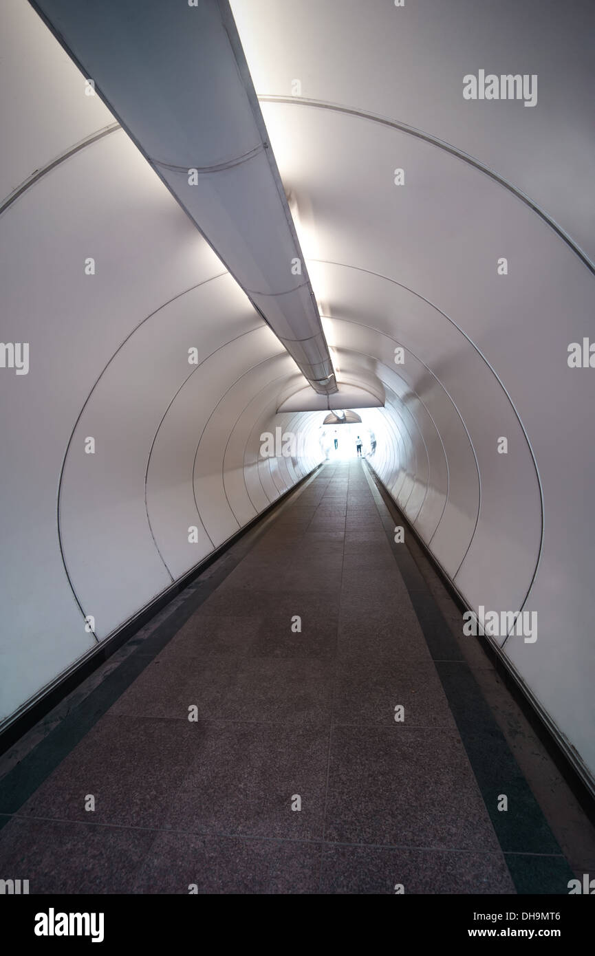 Modern pedestrian tunnel with people silhouettes Stock Photo - Alamy