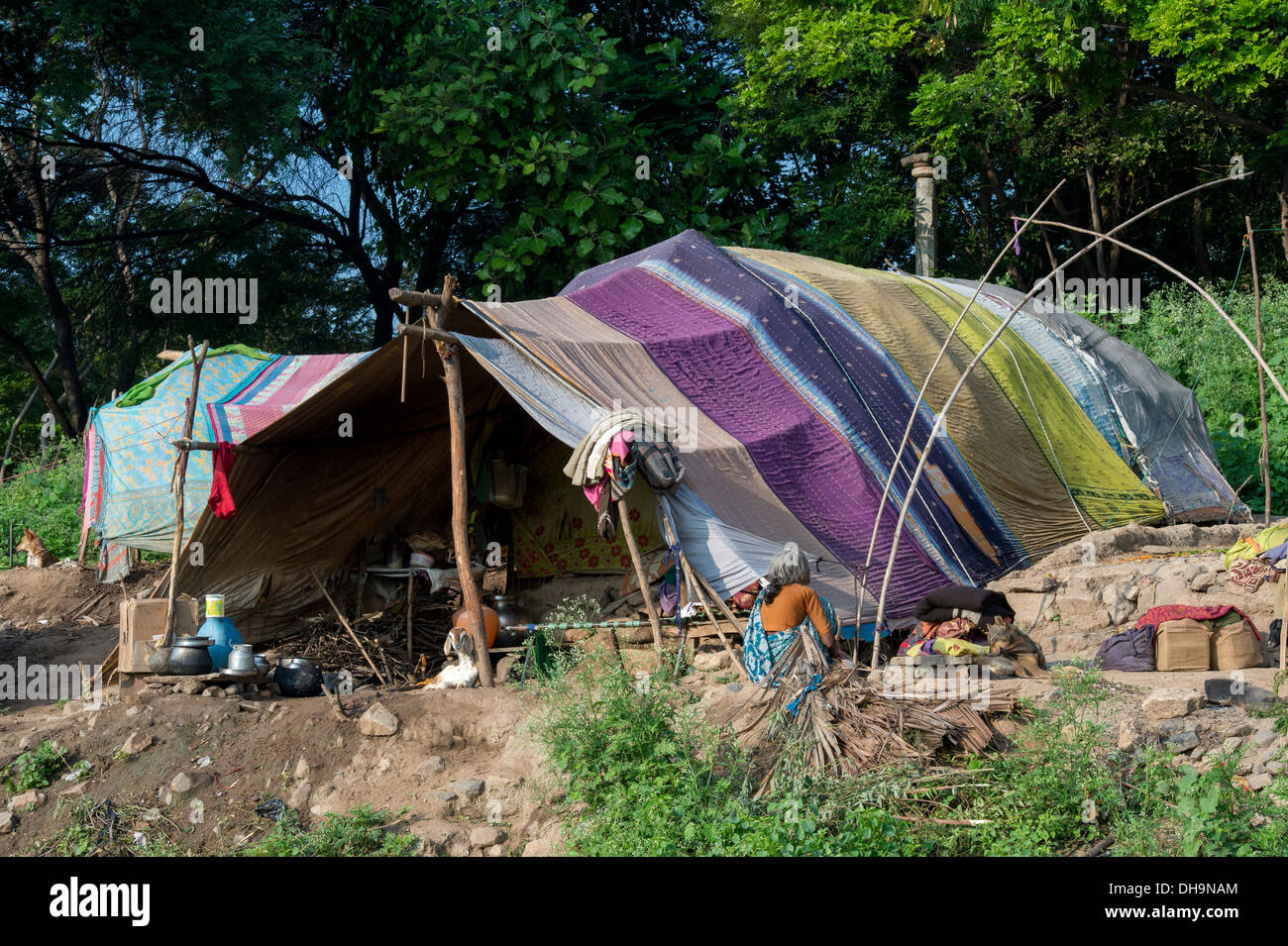 Lower caste Indian woman sitting outside her bender / tent / shelter ...
