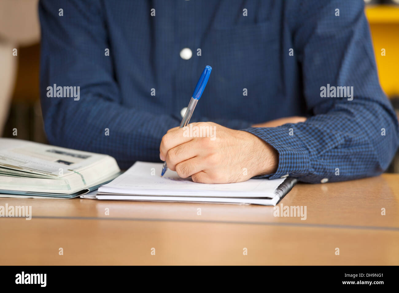 Asian college male writing hi-res stock photography and images - Alamy
