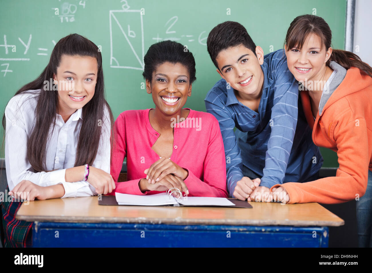 Teacher With Teenage Students In Classroom Stock Photo - Alamy