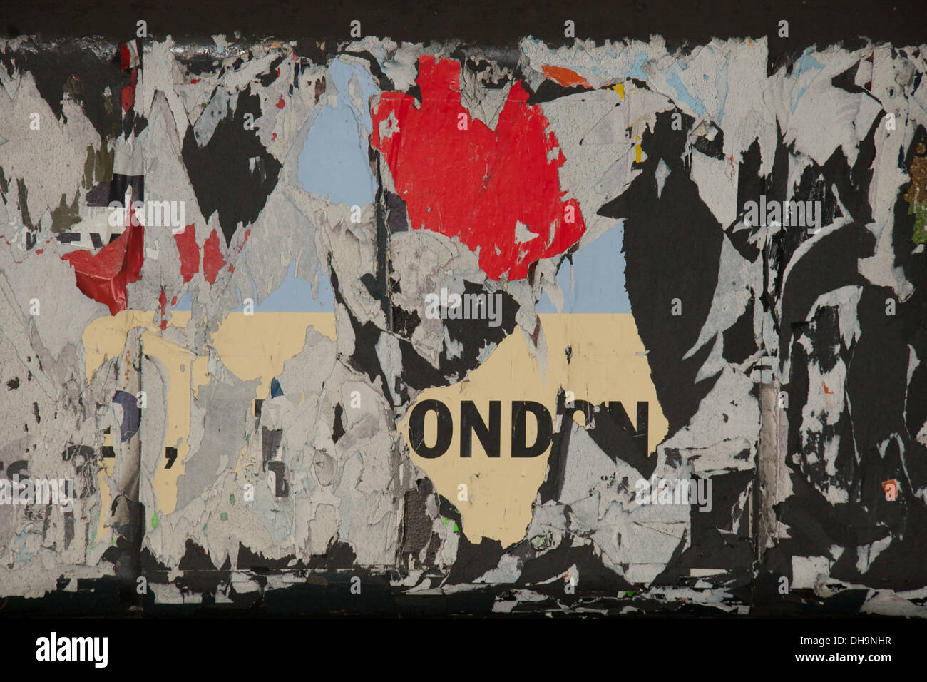 Peeling layers of paper advertising posters on London underground Stock ...