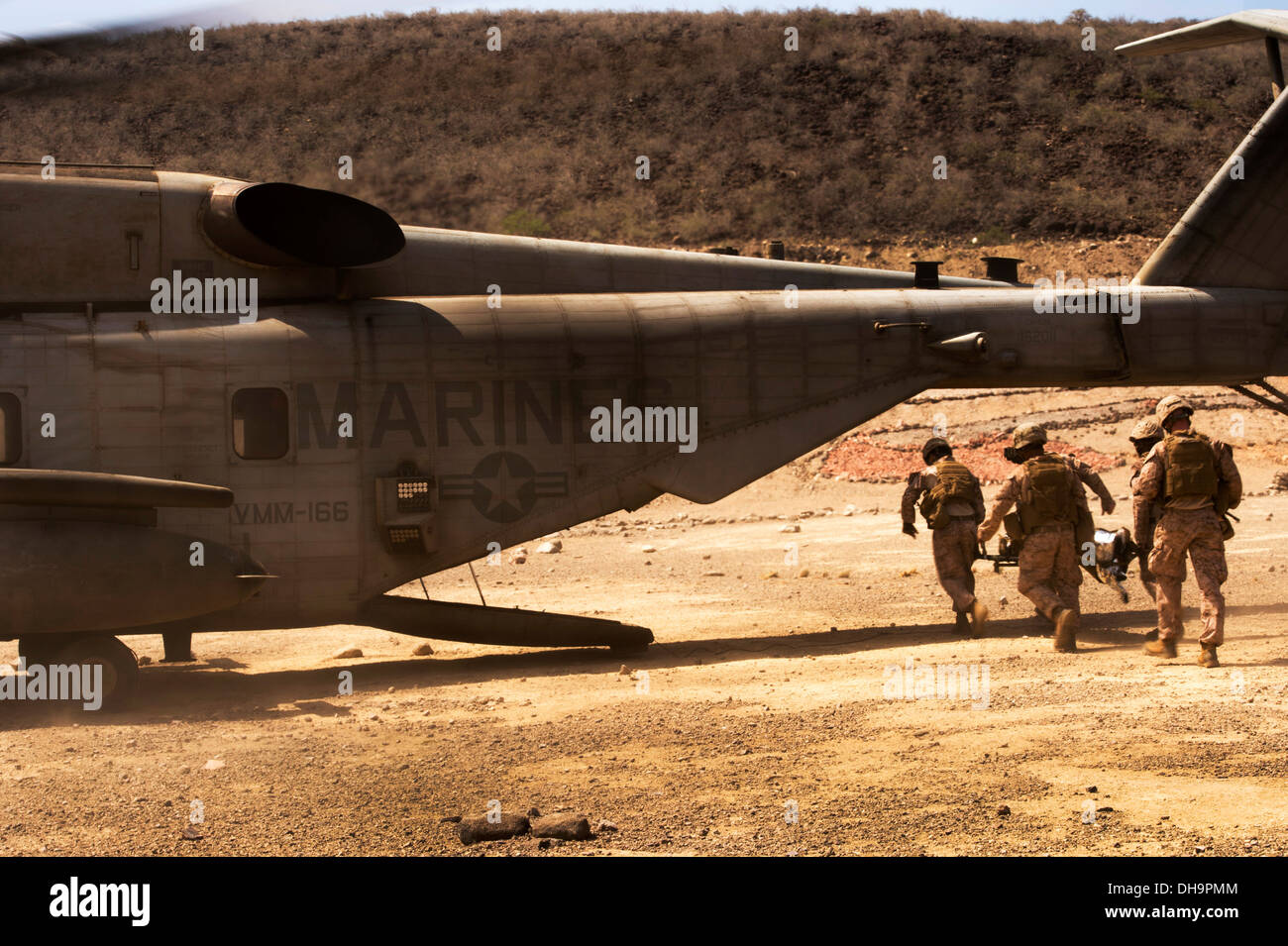 U.S. Marines with the 13th Marine Expeditionary Unit (MEU) litter carry ...