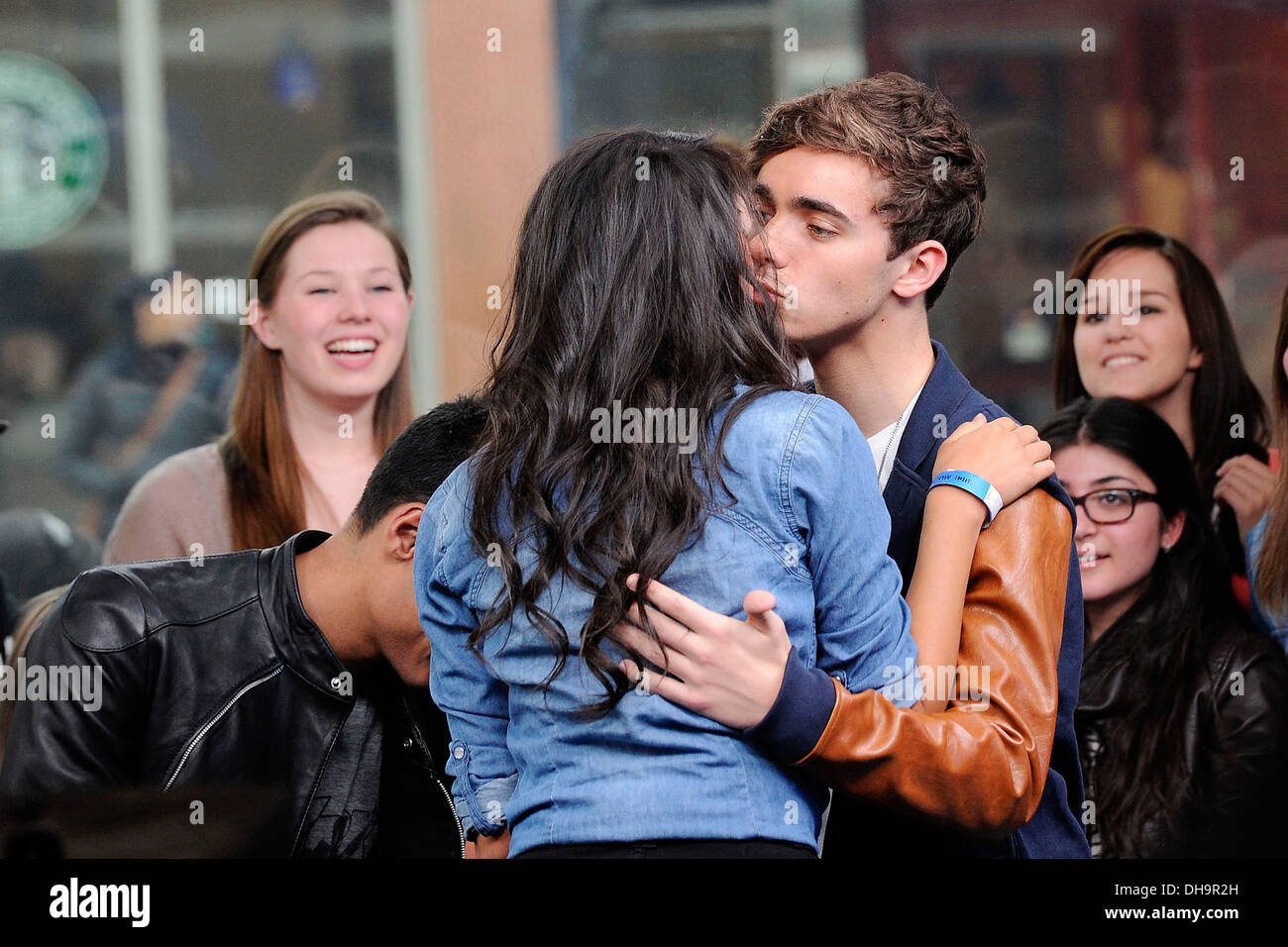 Nathan Sykes kisses a female audience during a contest game while 'The ...