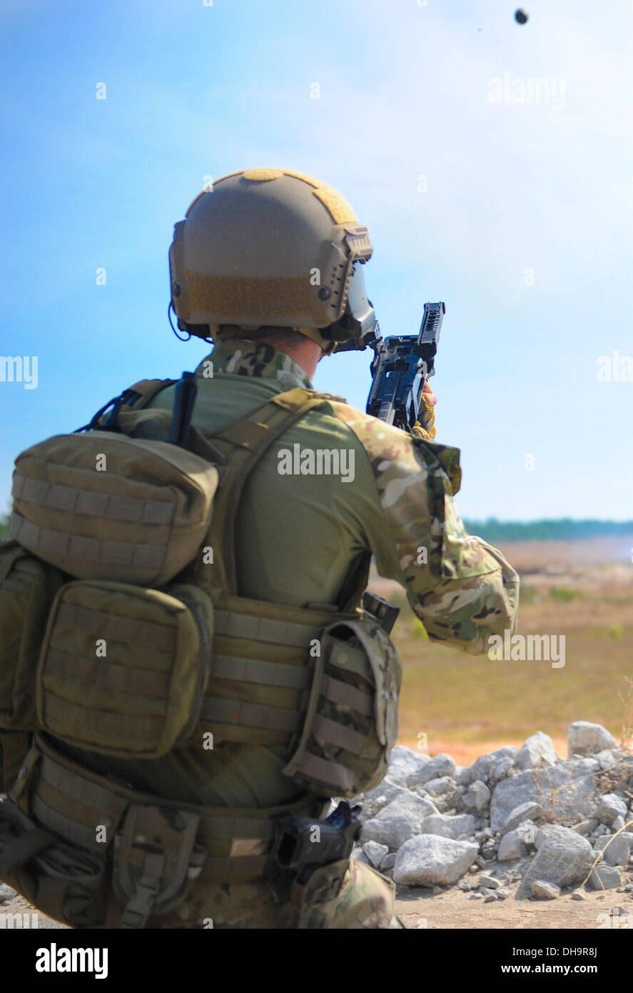 An Army Special Forces member fires an M320 grenade launcher on Eglin ...