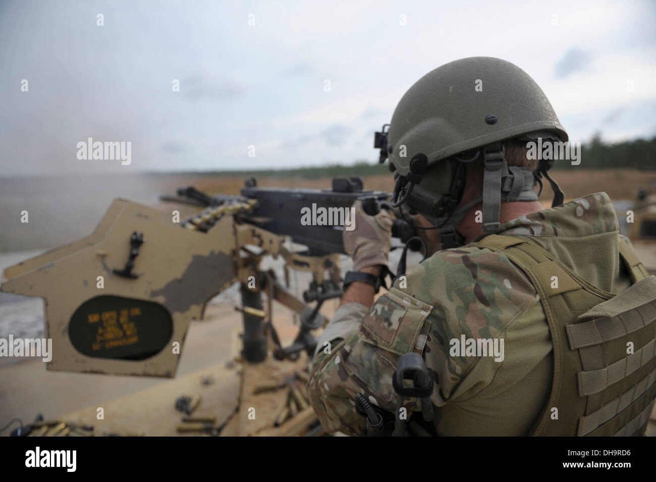 An Army Special Forces member fires a M2 browning 50-caliber machine ...