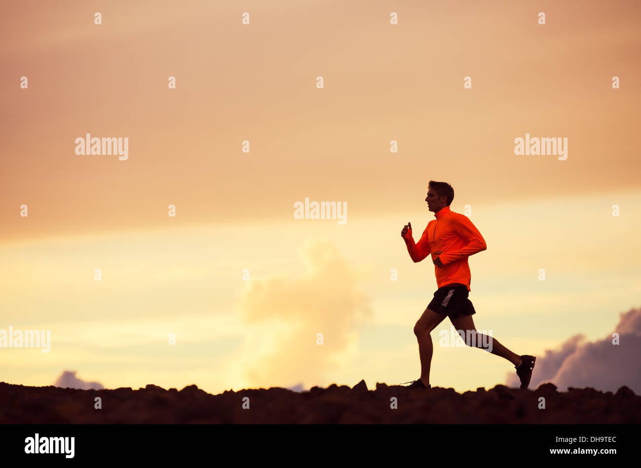 Male runner silhouette, Man running into sunset, colorful sunset sky ...
