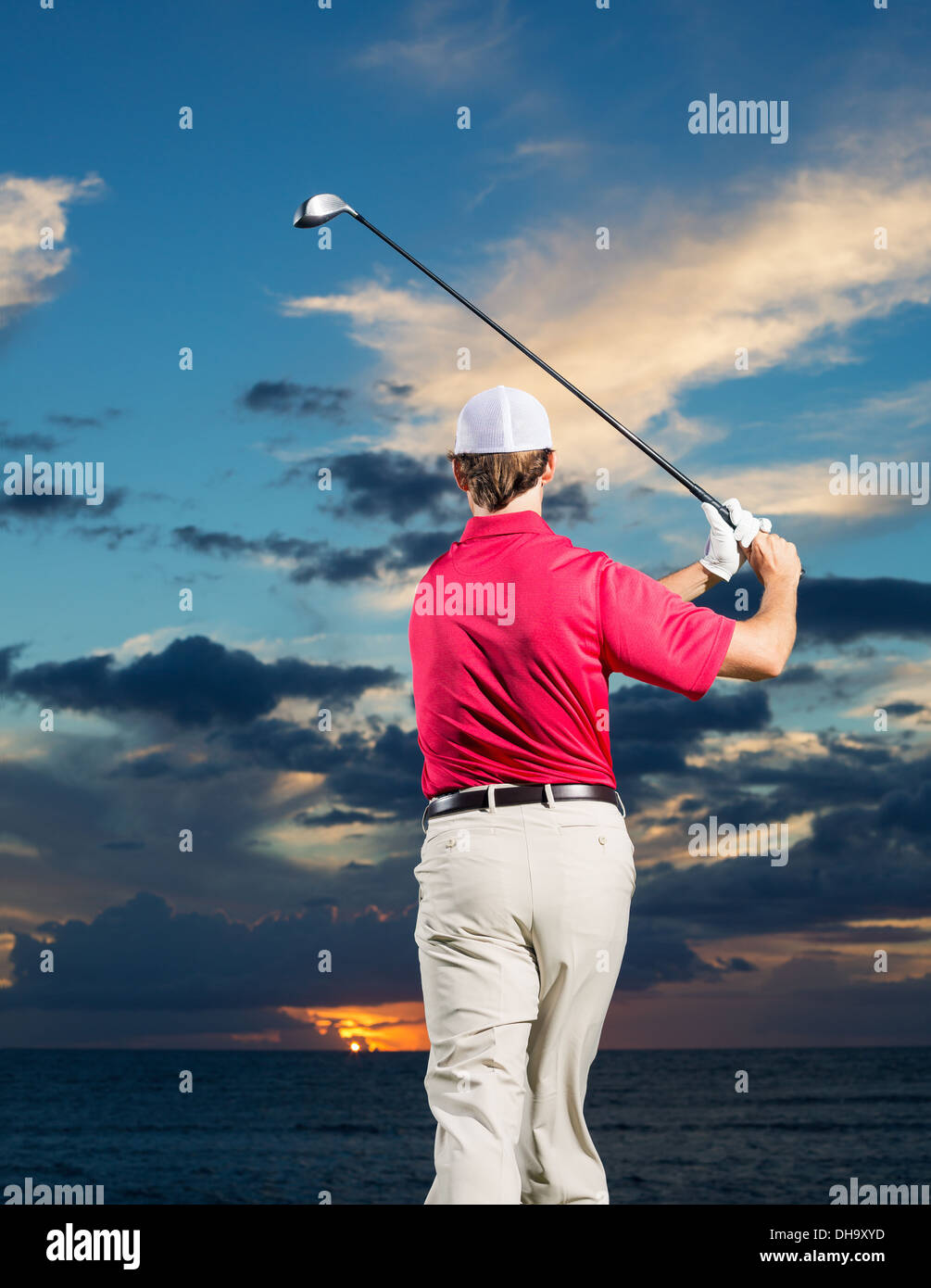 Golfer at sunset, Man swinging golf club with dramatic sunset sky ...