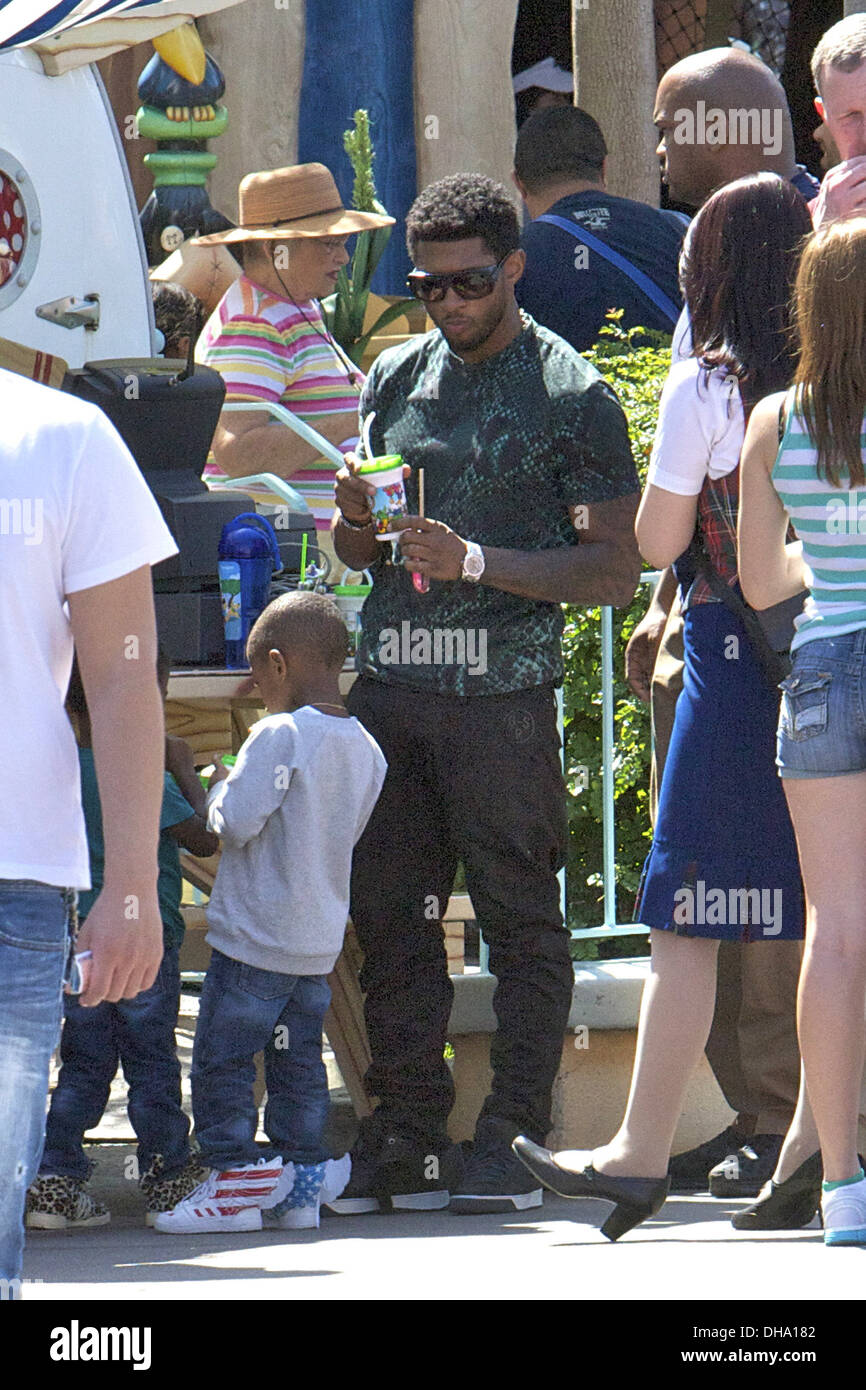 Usher enjoys day at Disneyland with his family Anaheim California - 06. ...