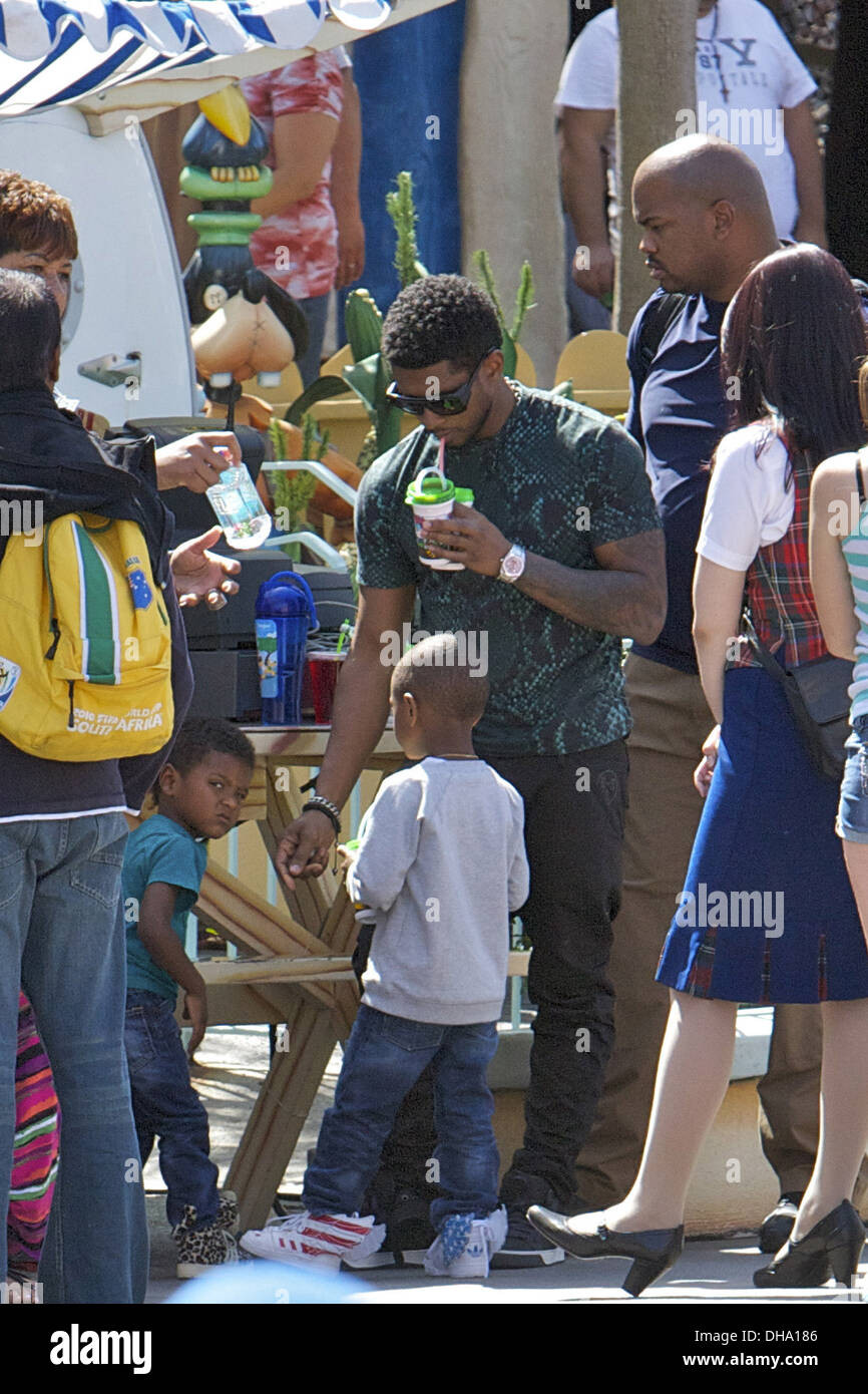 Usher enjoys day at Disneyland with his family Anaheim California - 06. ...