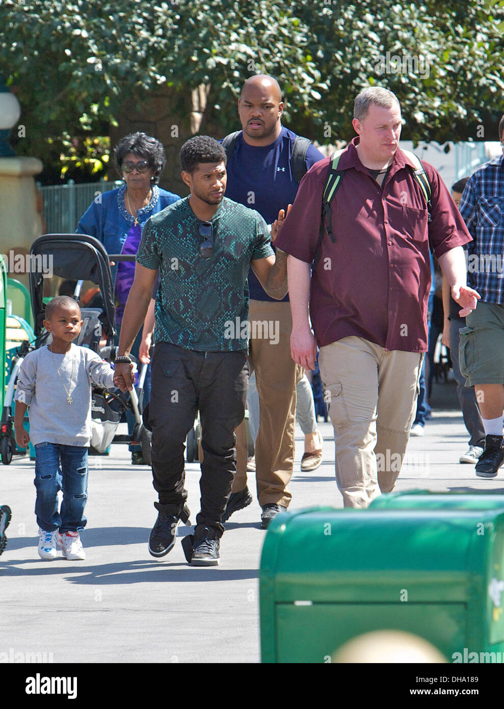 Usher enjoys the day at Disneyland with his family Anaheim, California ...
