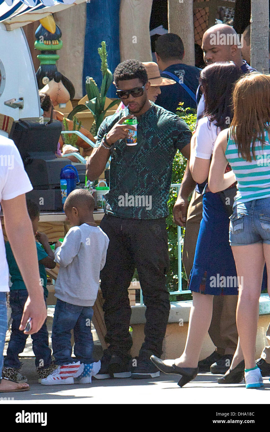 Usher enjoys the day at Disneyland with his family Anaheim, California ...