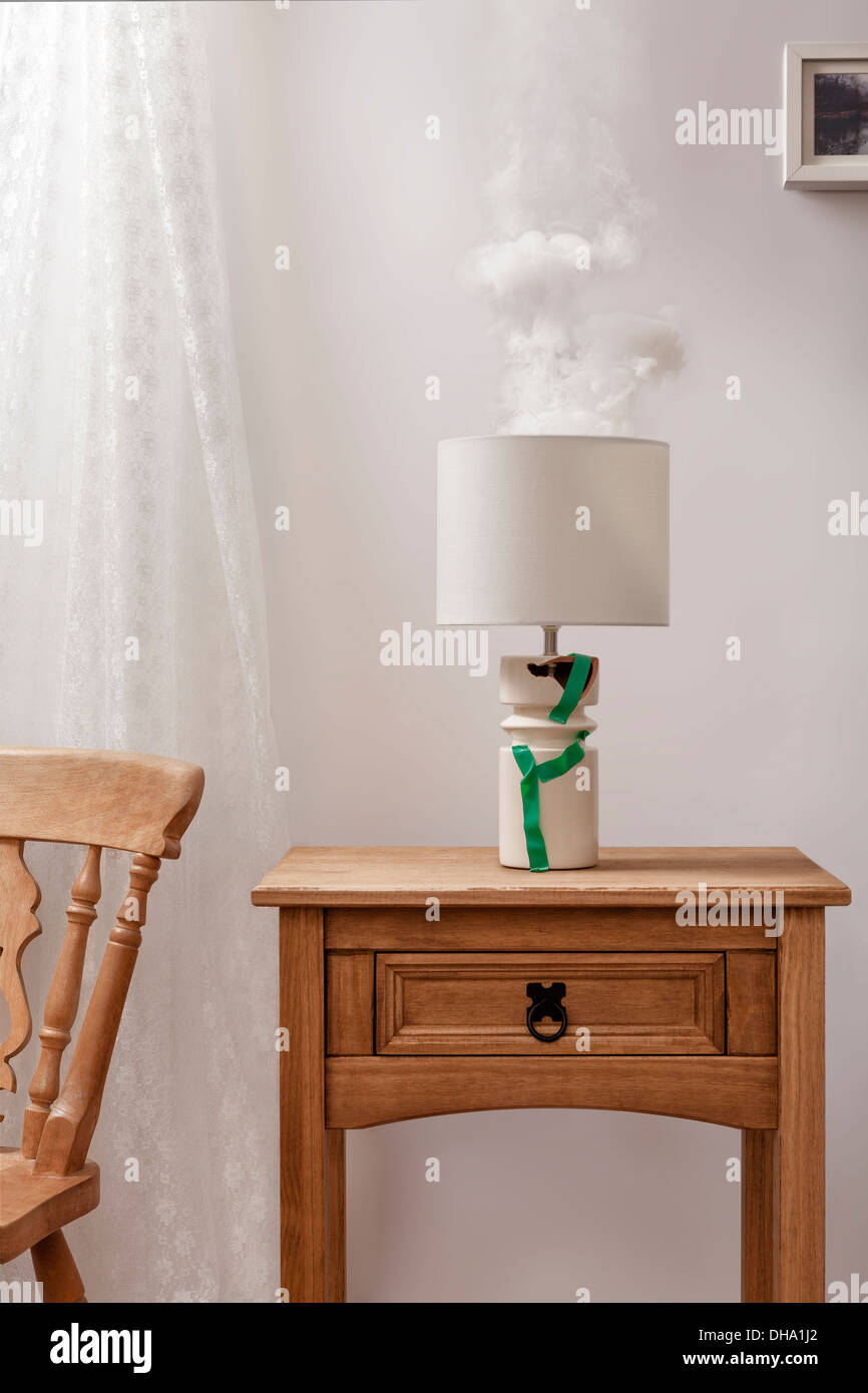Broken lamp billowing smoke Stock Photo - Alamy