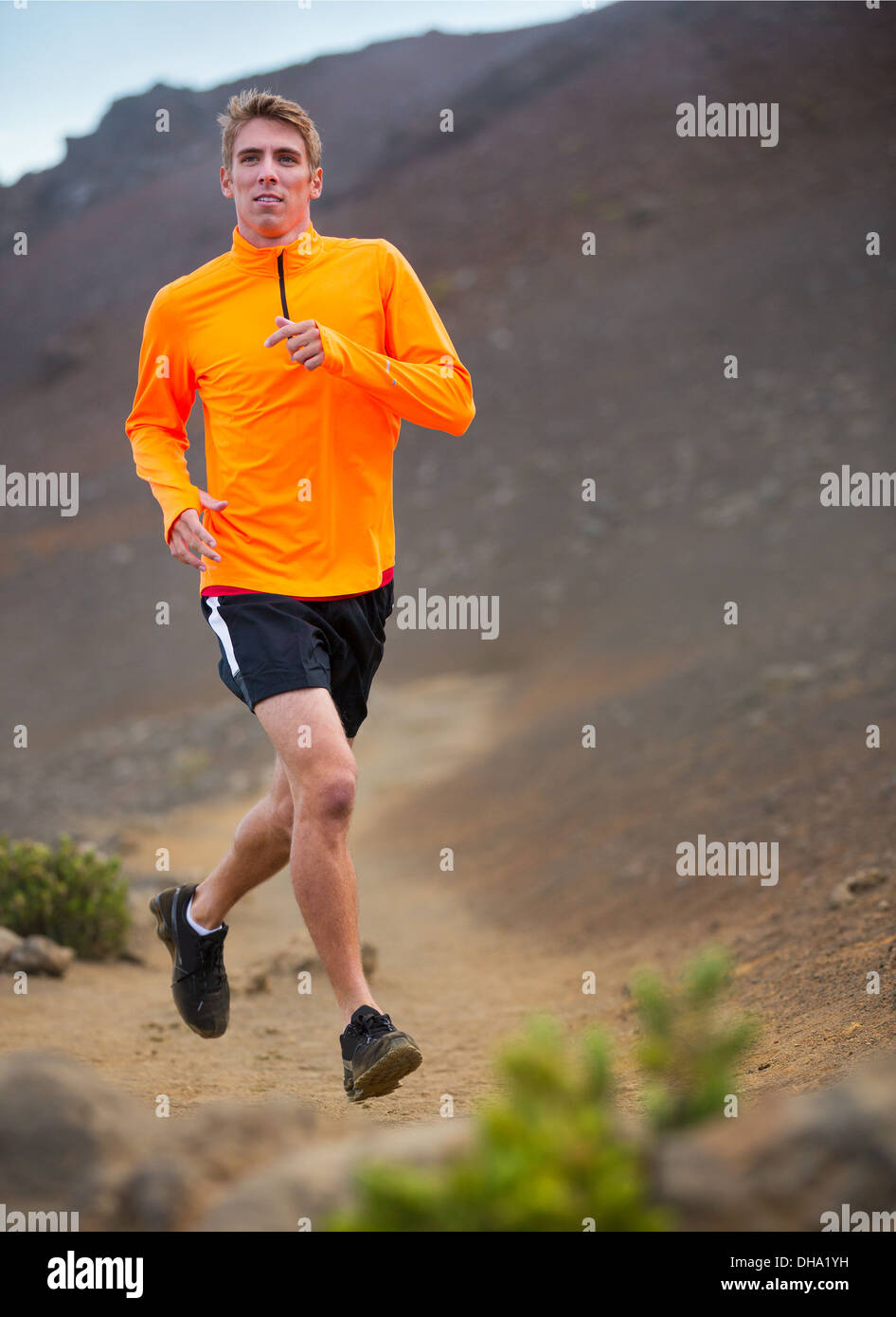 Athletic man jogging outside, training outdoors. Running on nature ...