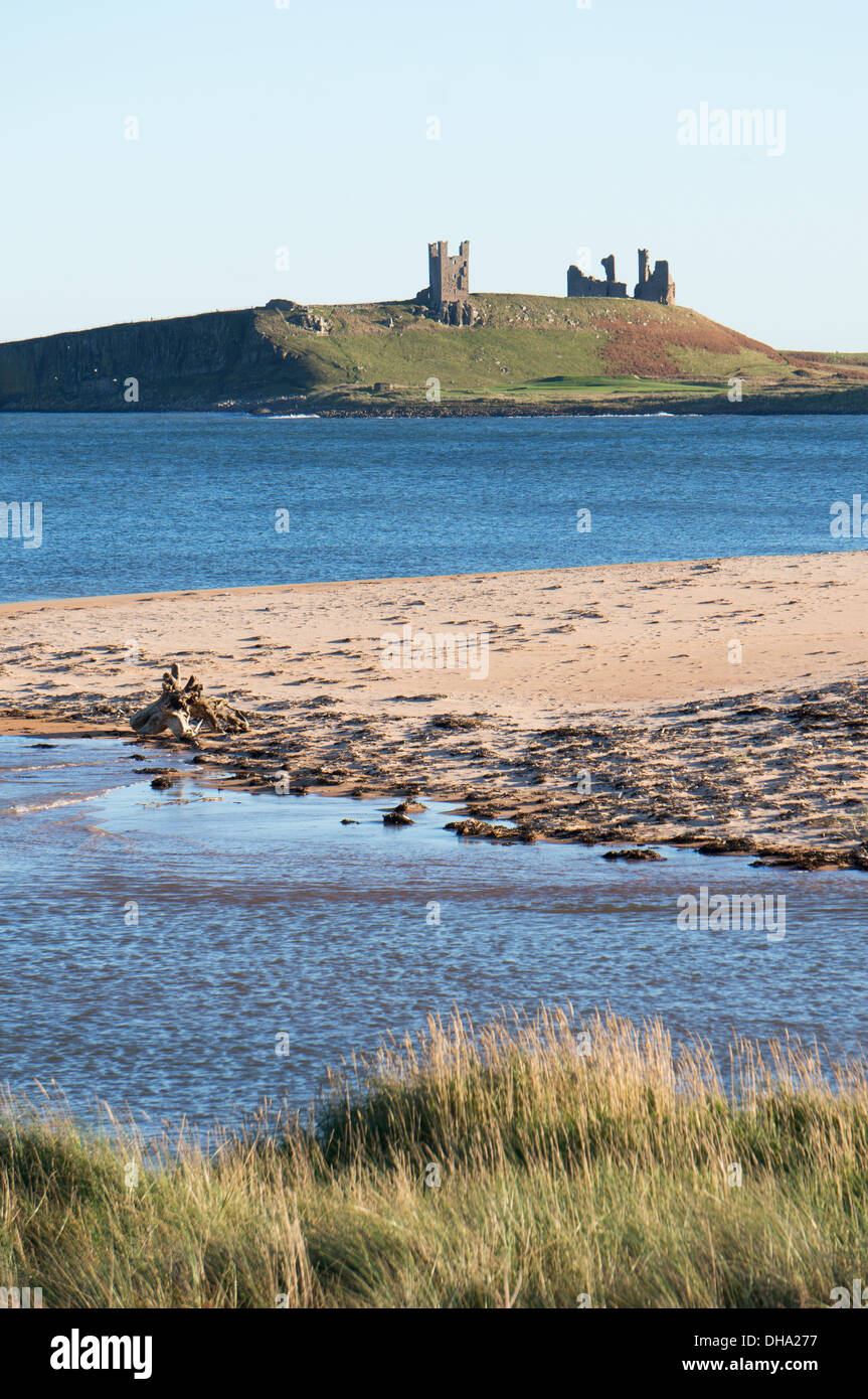 North sea coastline and Dunstanburgh Castle, Northumberland, England ...