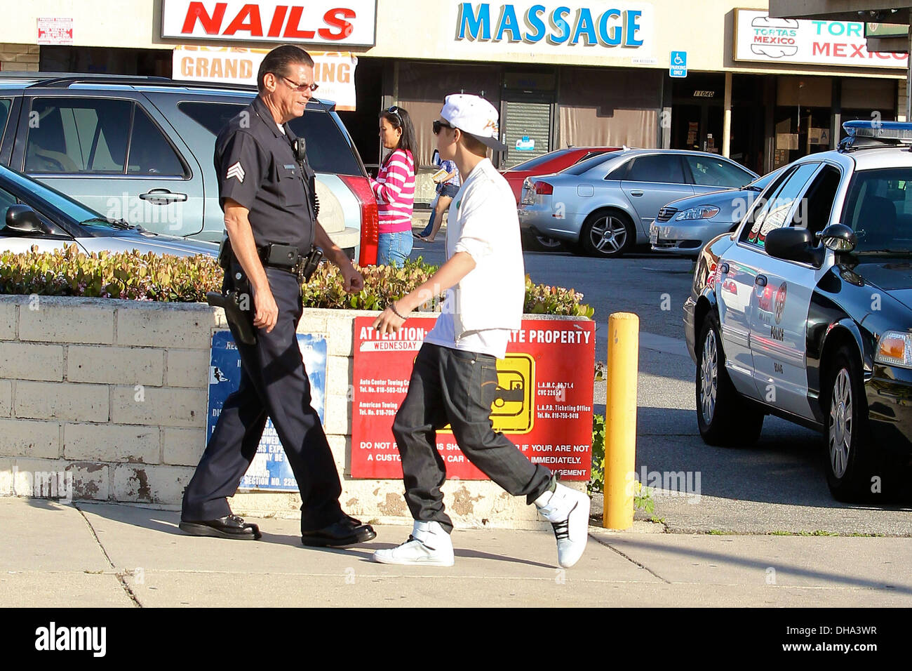 Justin Bieber is asked by a Los Angeles police officer to move his £60k ...