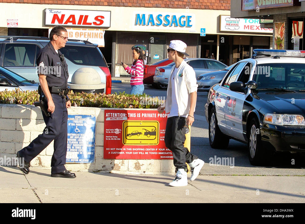 Justin Bieber is asked by a Los Angeles police officer to move his £60k ...
