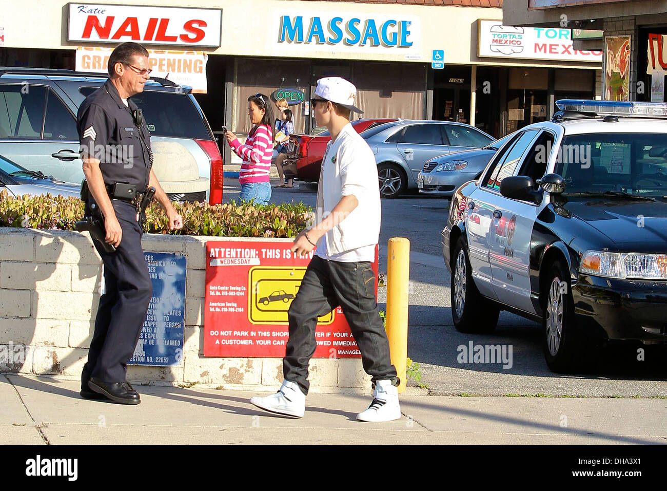 Justin Bieber is asked by a Los Angeles police officer to move his £60k ...
