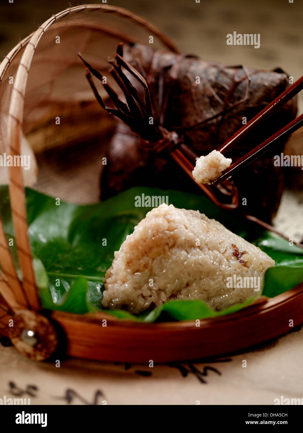 Chinese traditional food Zongzi in a bamboo container Stock Photo - Alamy