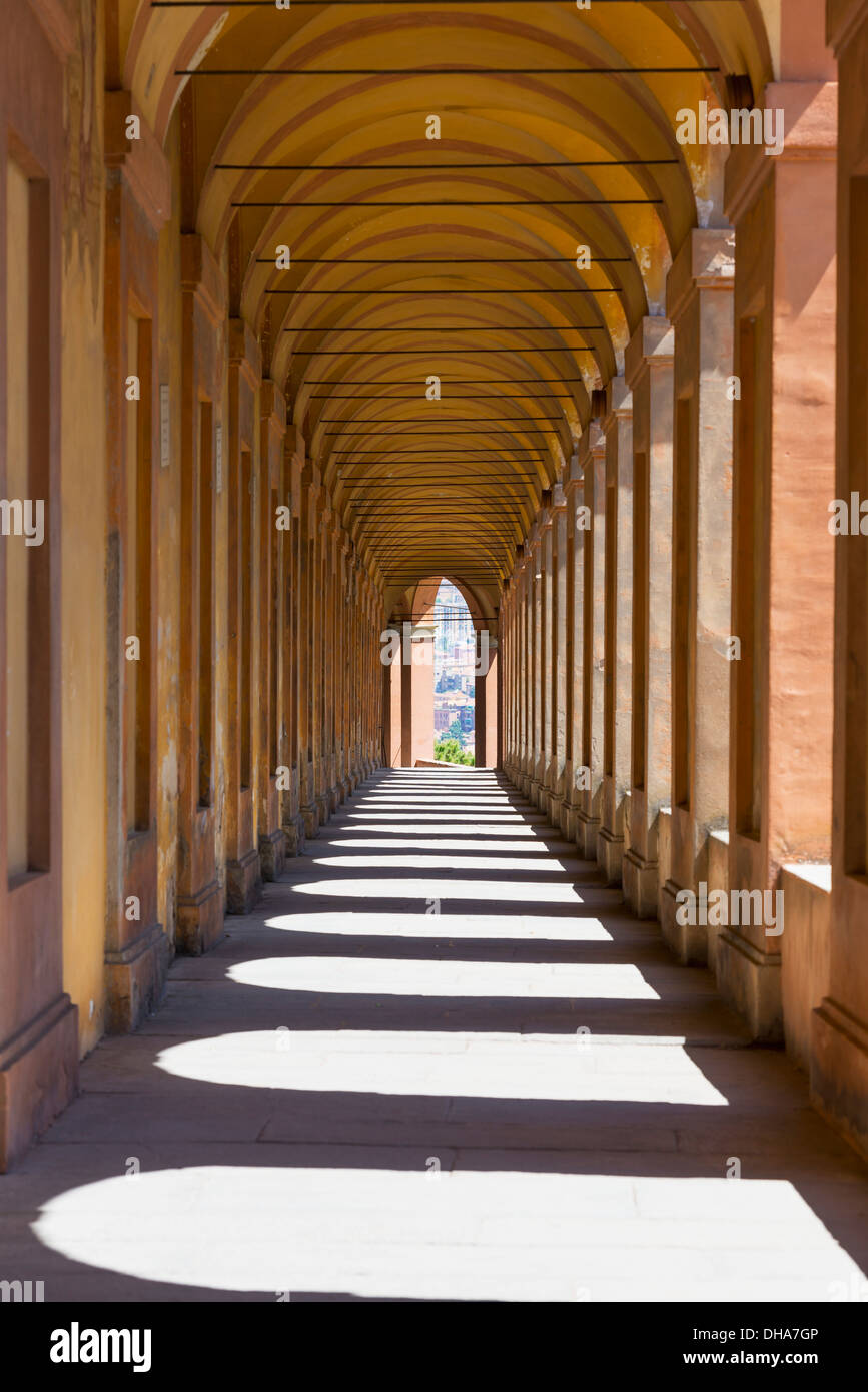 An Outside Corridor With Arched Roof And Shadows Of Arches Cast On The ...