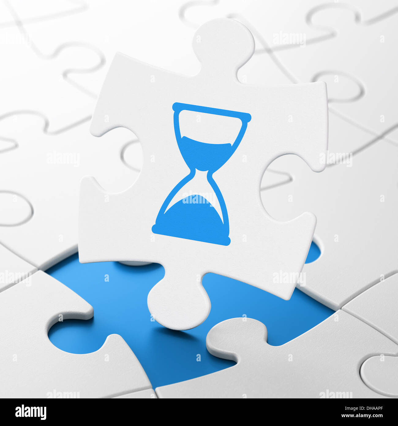 Time concept: Hourglass on puzzle background Stock Photo - Alamy