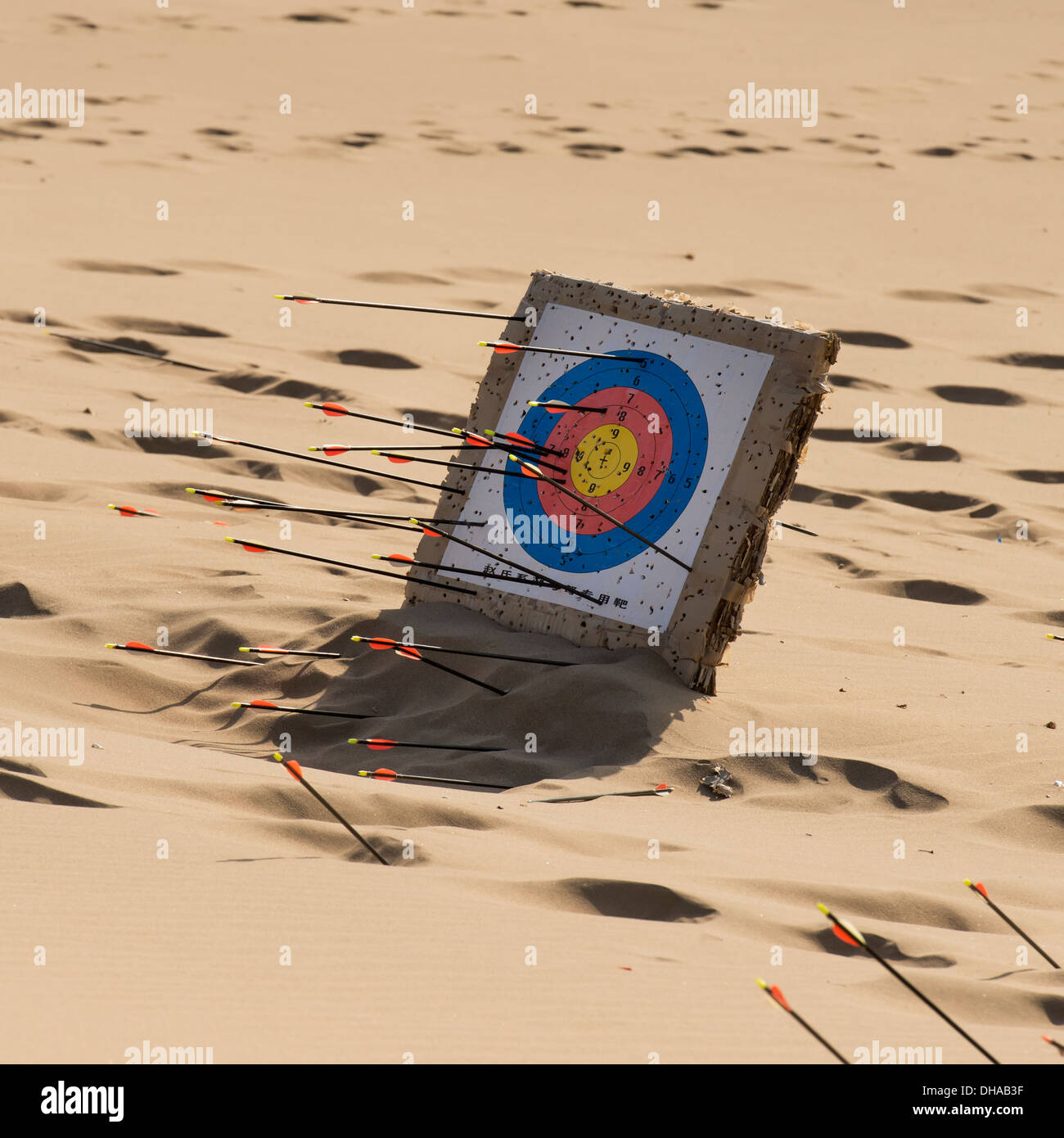 Arrows Stuck In A Target On The Sand Stock Photo - Alamy