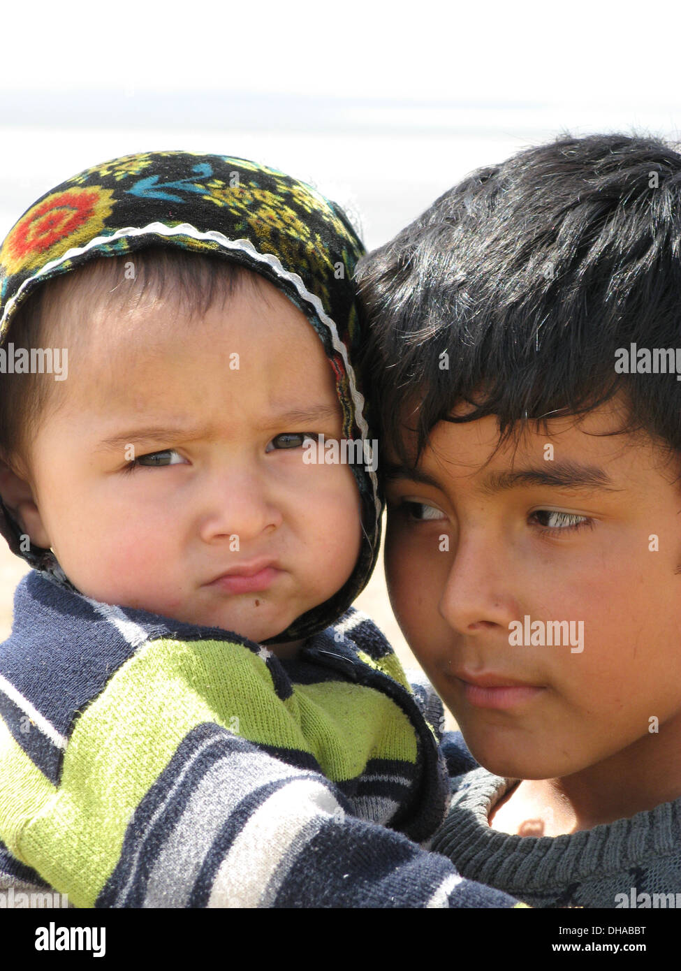 Traditional boy and baby near Samarkand, Uzbekistan Stock Photo - Alamy