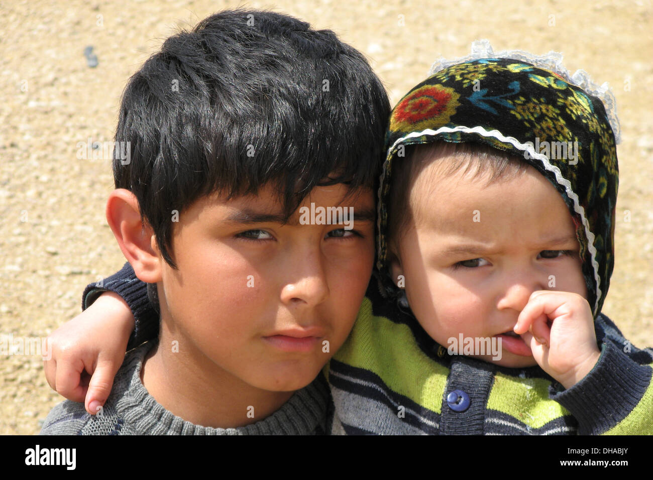 Traditional boy and baby near Samarkand, Uzbekistan Stock Photo - Alamy
