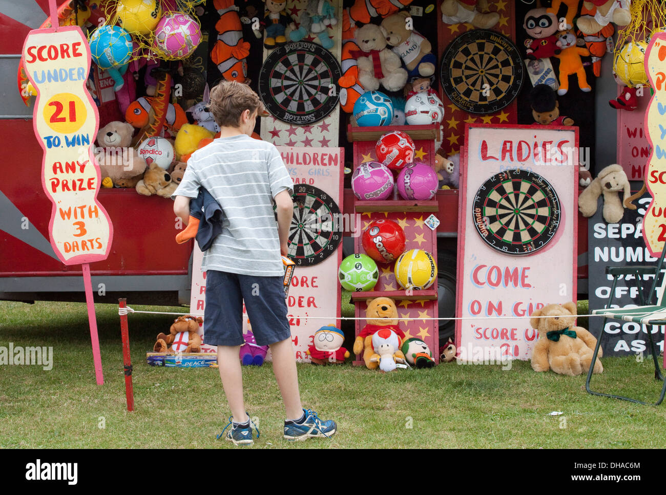 Young man looks at a fairground booth that offers special terms for ...