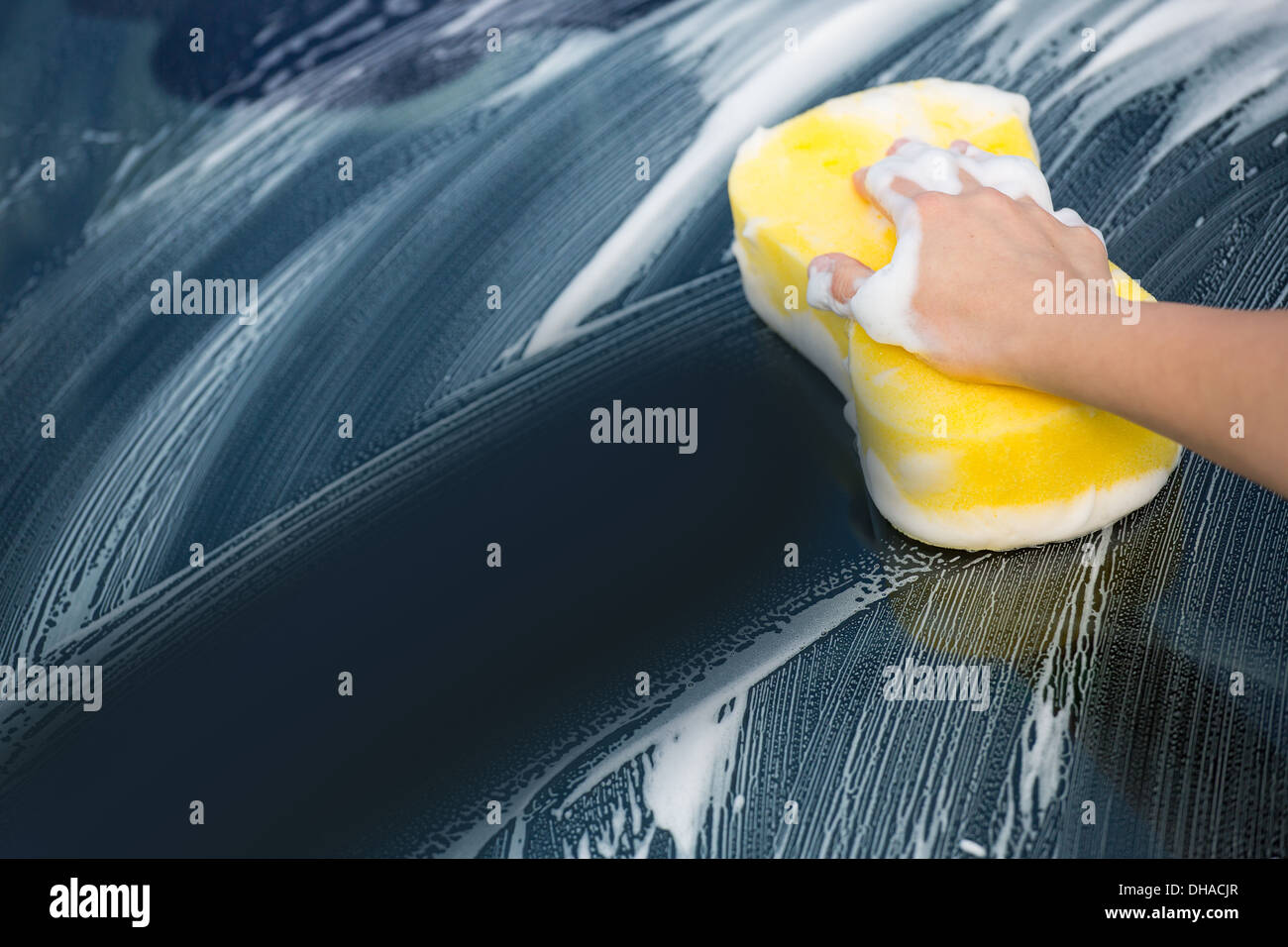 sponge over the car for washing Stock Photo - Alamy