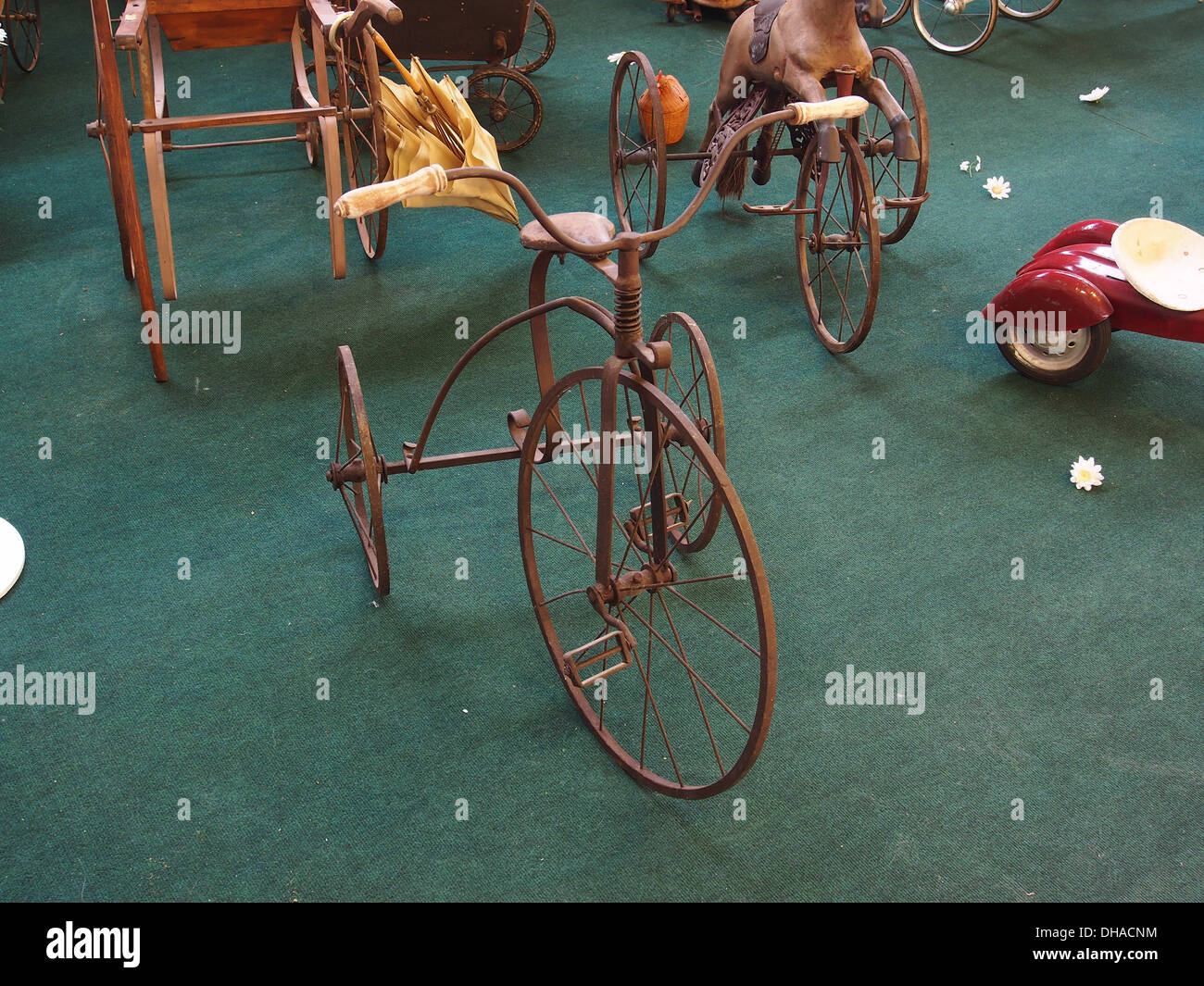 This old children's tricycle, a vintage toy, represents early 20th ...