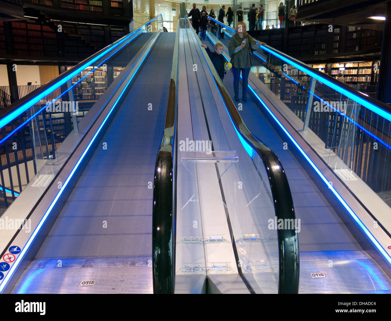 The blue neon escalators inside the Birmingham library Stock Photo - Alamy