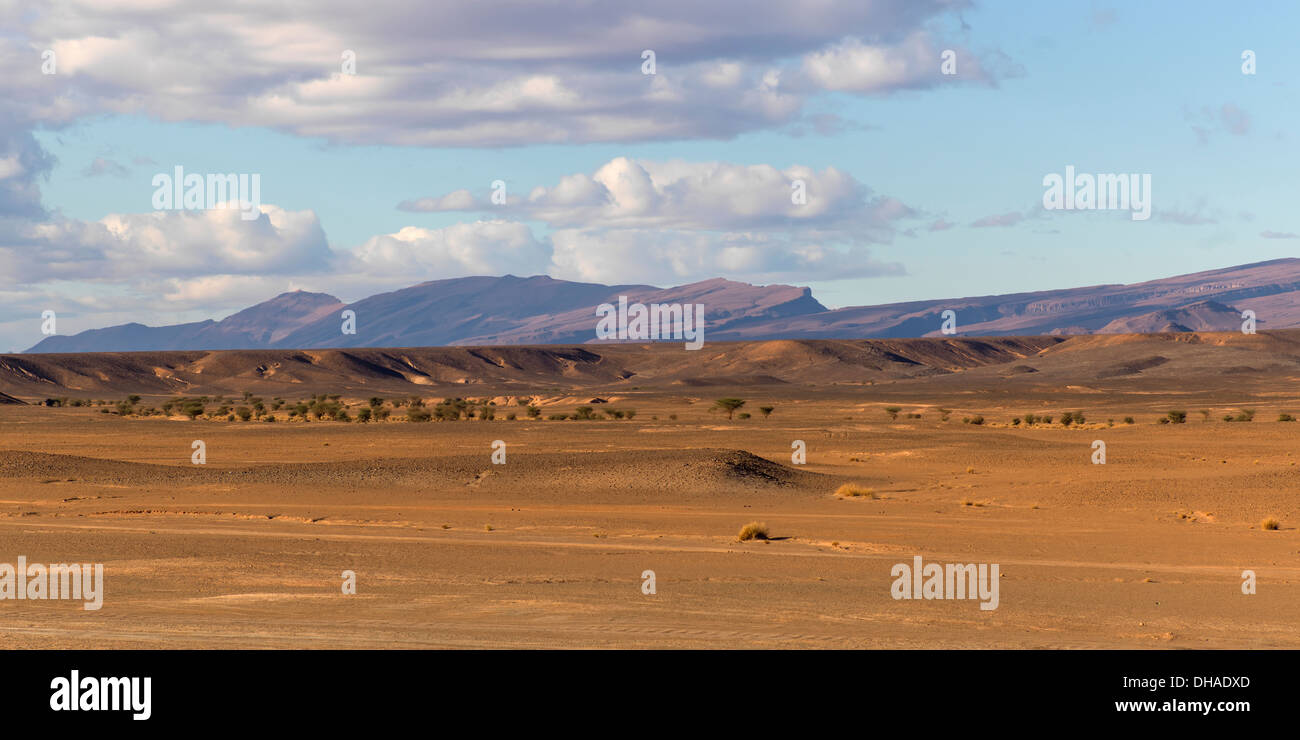 Arid And Barren Landscape With Mountains In The Background Stock Photo ...