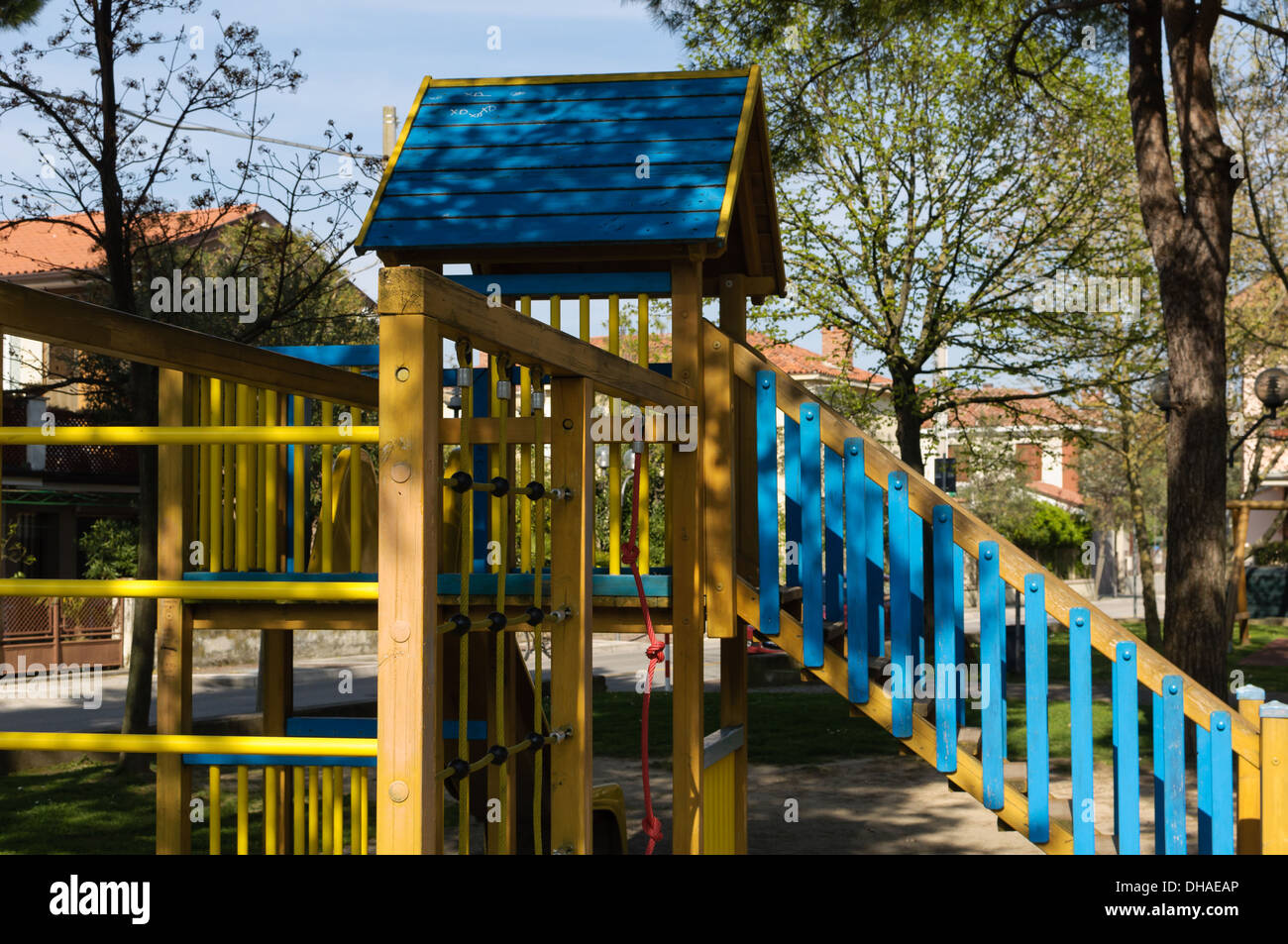 Colored wooden slide in a children playground Stock Photo - Alamy