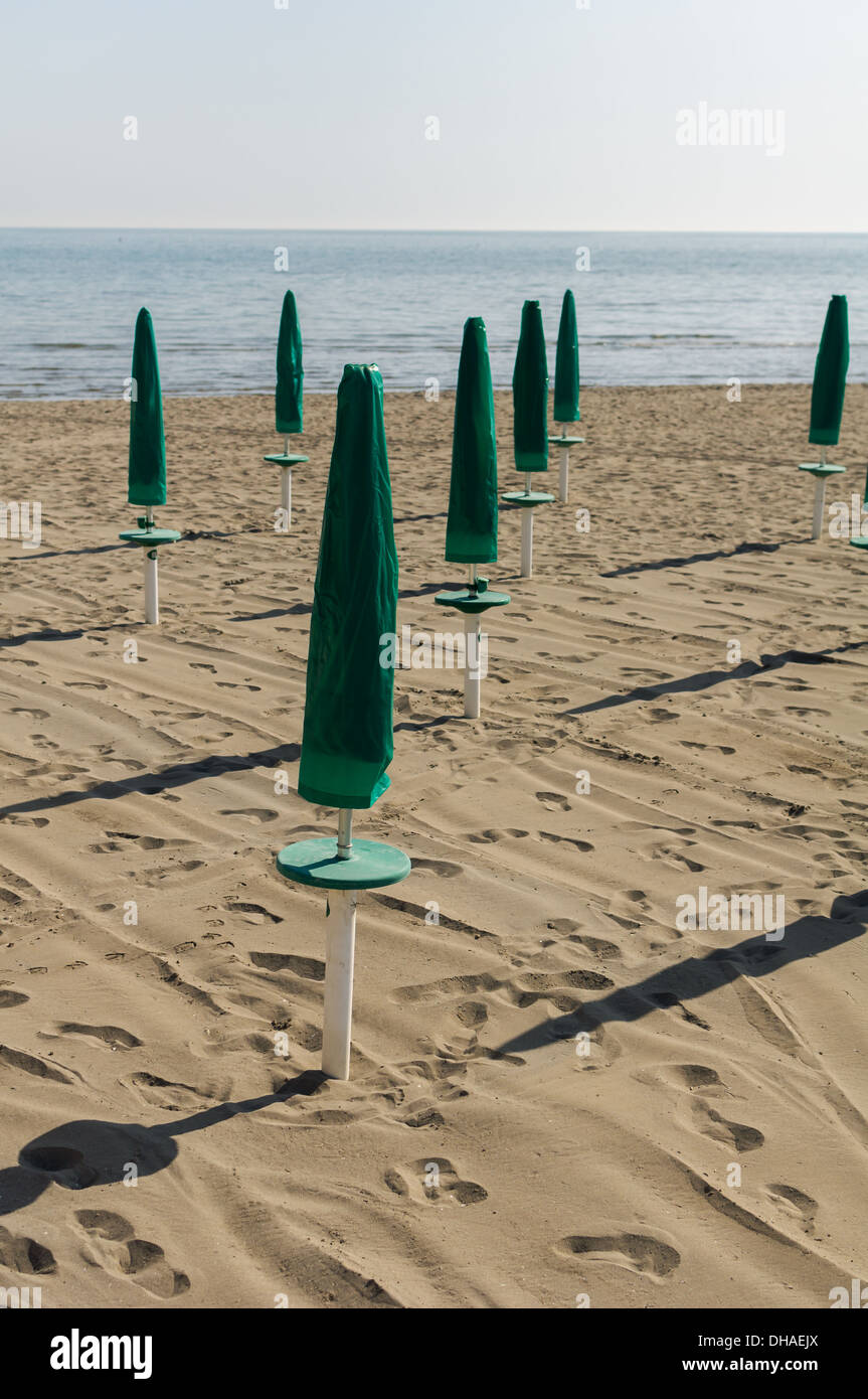 Green parasol on the beach Stock Photo - Alamy