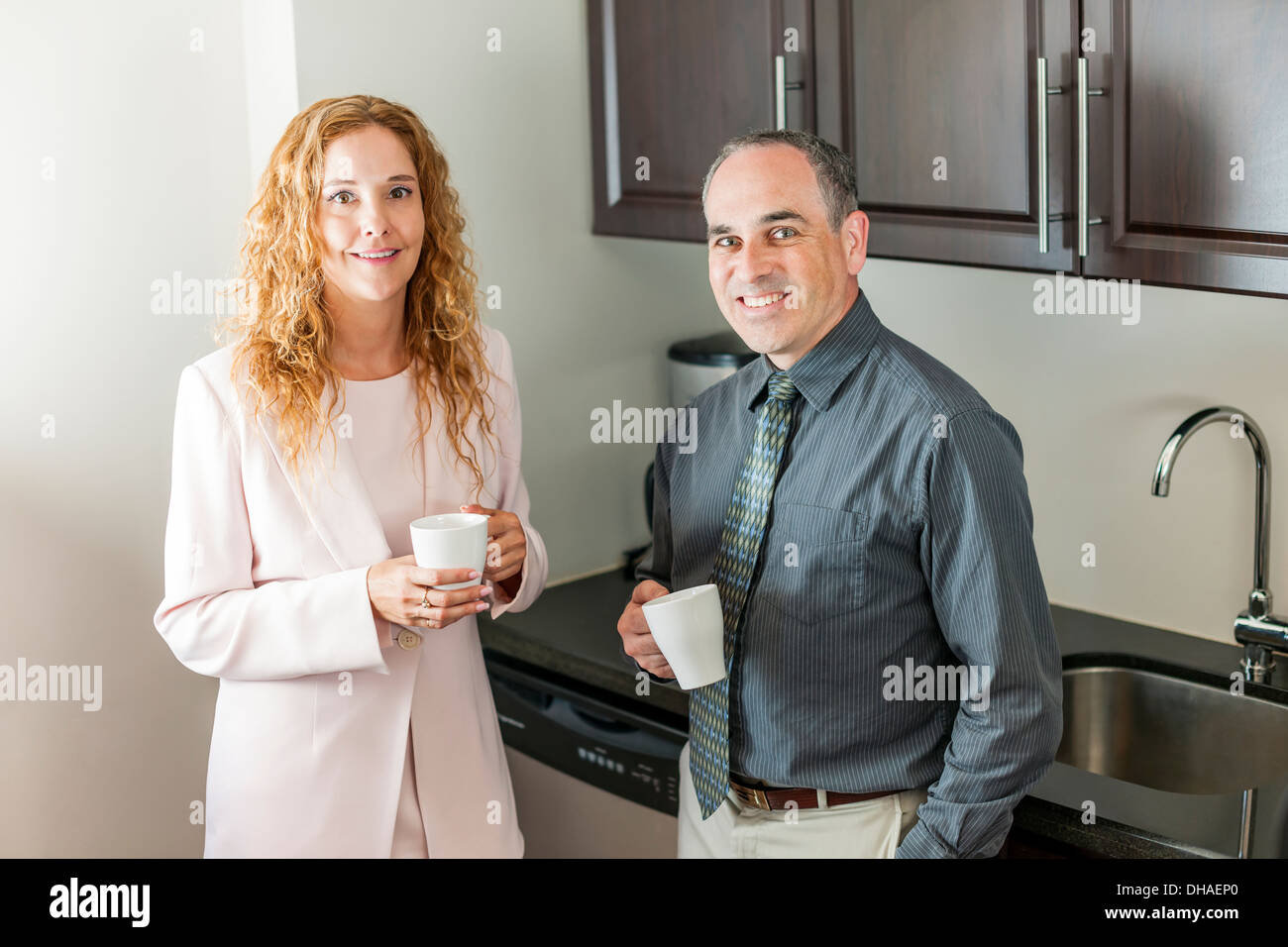 Attractive woman and coworkers with coffee cups in restaurant Stock ...