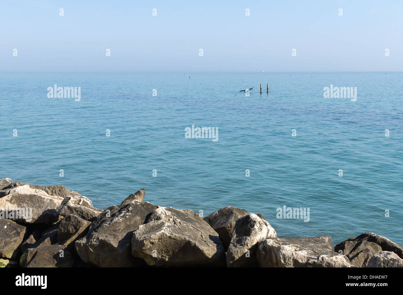 Two poles in the sea Stock Photo - Alamy