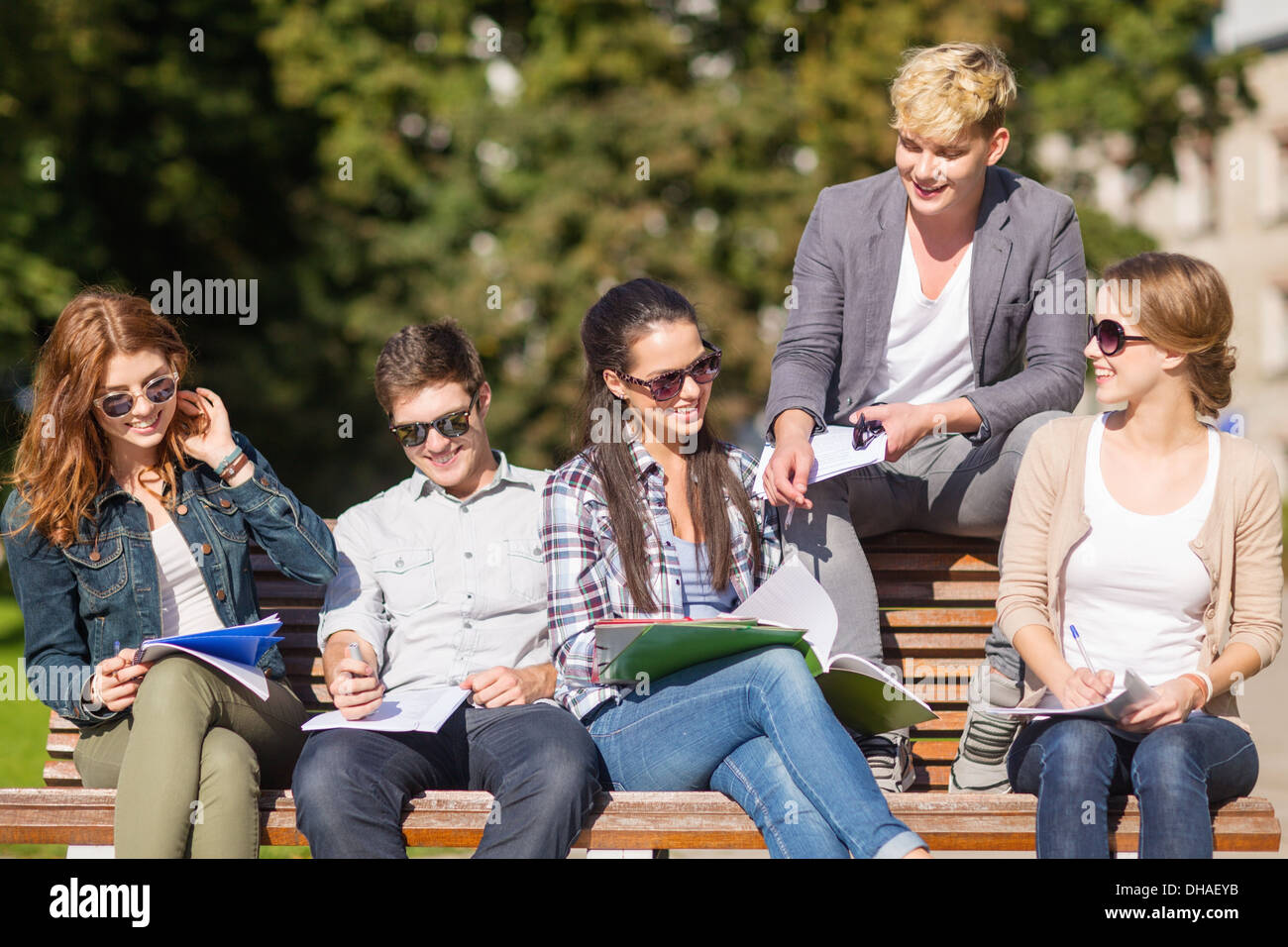 group of students or teenagers hanging out Stock Photo - Alamy