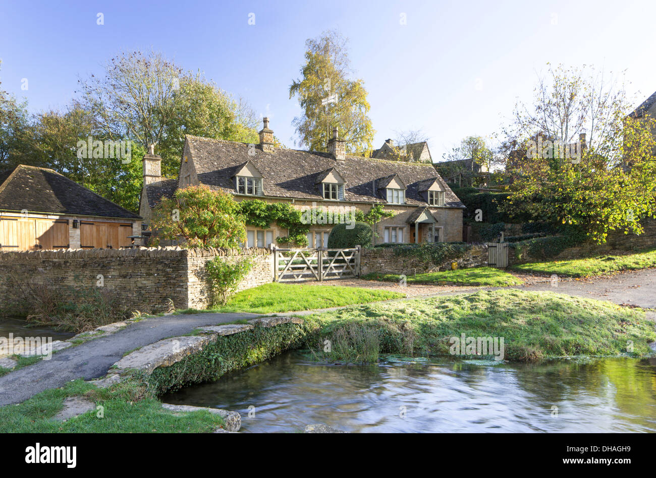 The Cotswold village of Upper Slaughter on the River Eye in evening ...