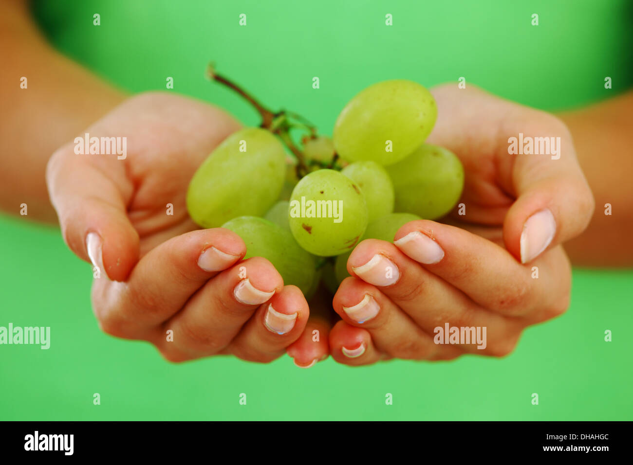 grape in woman hands close up Stock Photo - Alamy