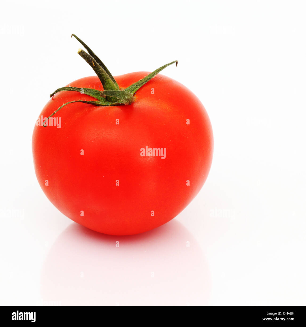 one tomato isolated on white Stock Photo - Alamy