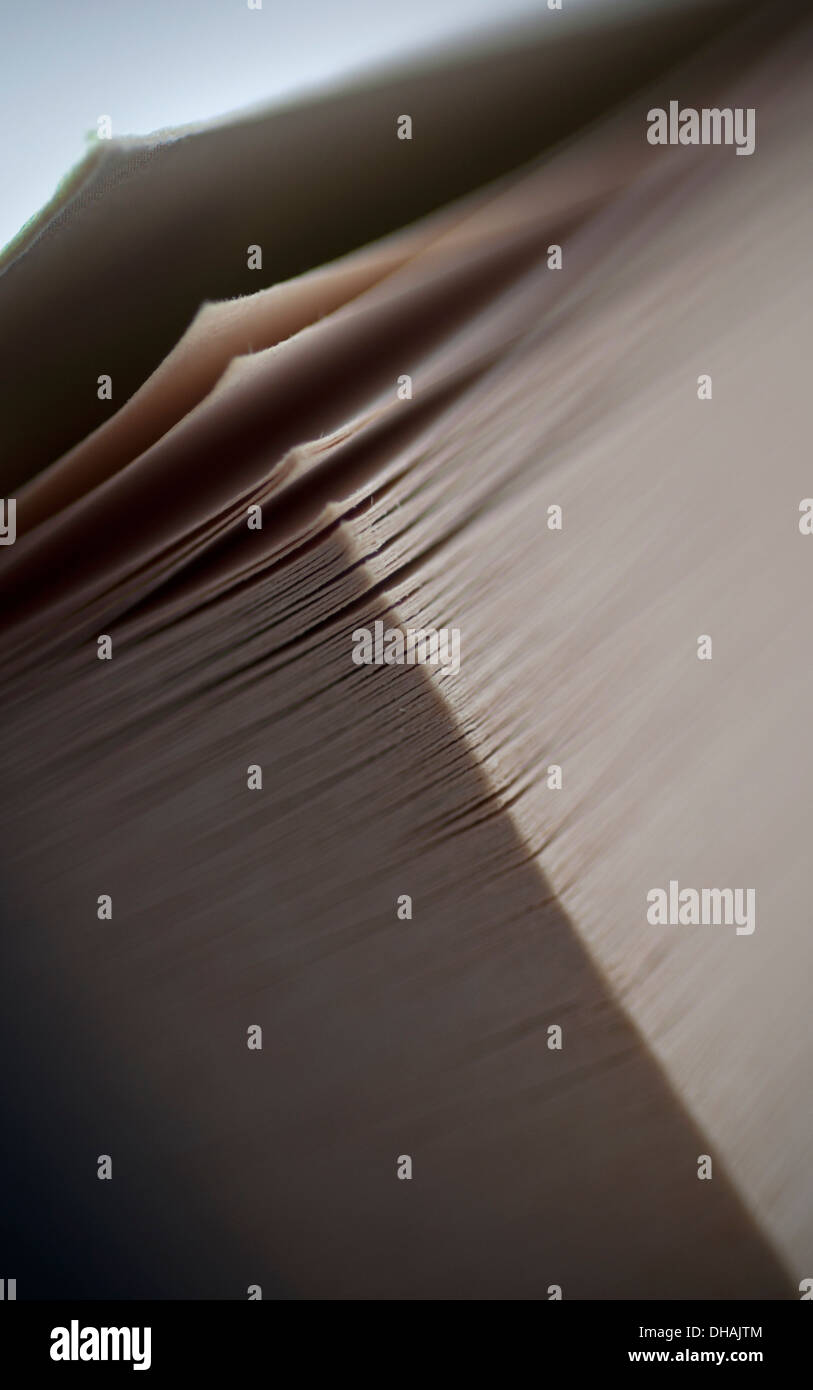 A close up image of a book corner and pages showing a diagonal line ...