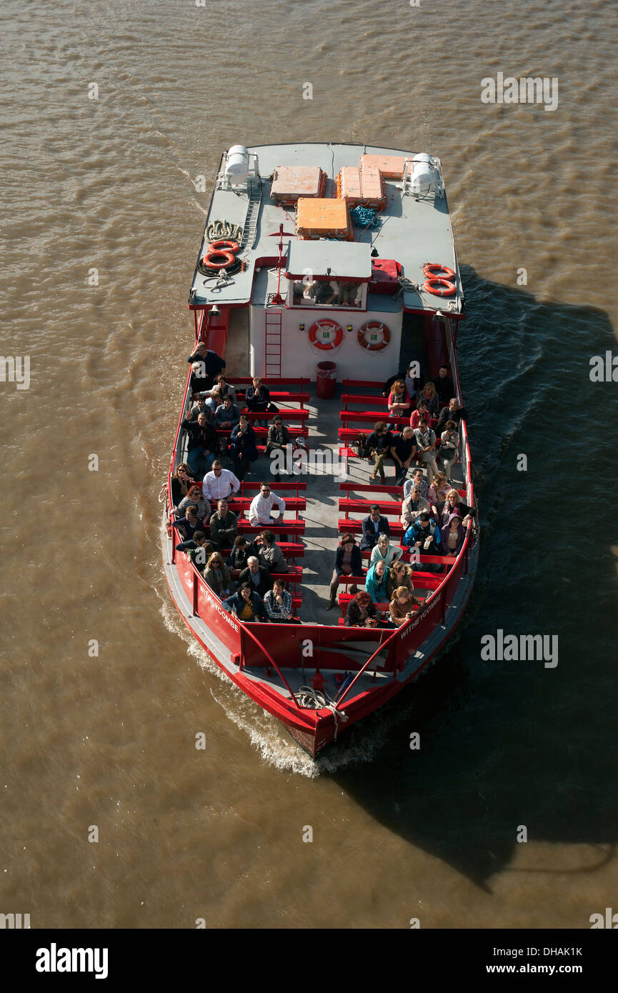 Tourist boat goes under Westminster Bridge on the River Thames, London ...